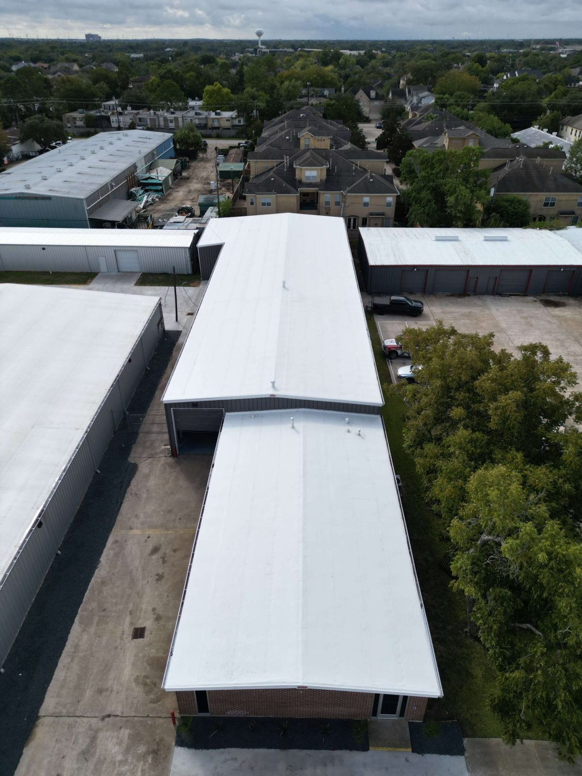 Finished TPO Roof Retrofit Over Metal Panels – HHH Roofing & Construction