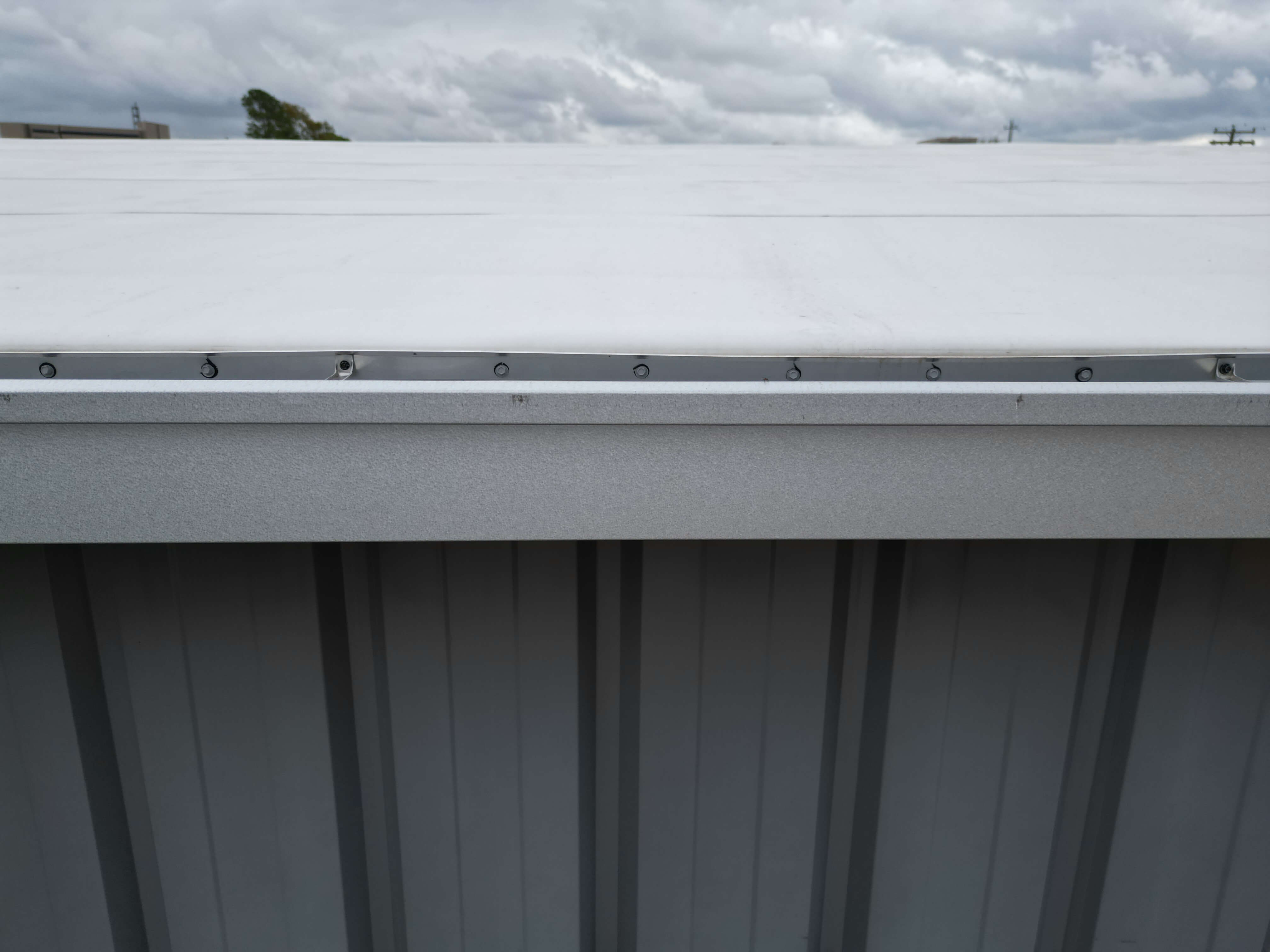 Houston_TPO_Metal_Retrofit_Roof_TerminationBar – HHH Roofing & Construction